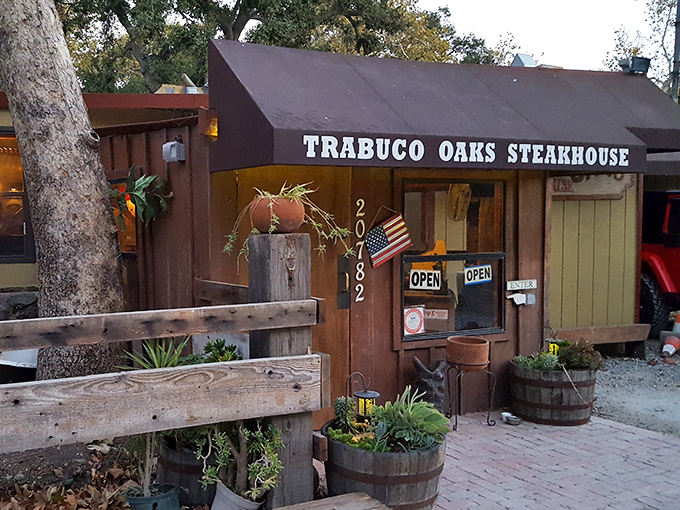 Like finding a treasure in the woods, Trabuco Oaks Steakhouse's charming exterior welcomes hungry travelers with rustic simplicity and the promise of legendary steaks.