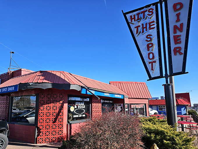 The iconic red-roofed diner with its vintage sign stands like a beacon of breakfast hope against the Colorado sky. Simplicity never looked so appetizing.