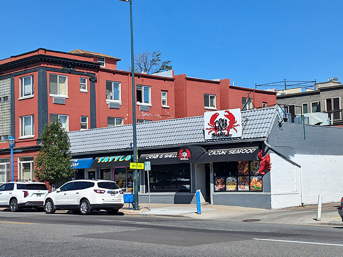 The bright red crab sign beckons like a lighthouse for seafood lovers lost in a landlocked state. Maritime salvation awaits!