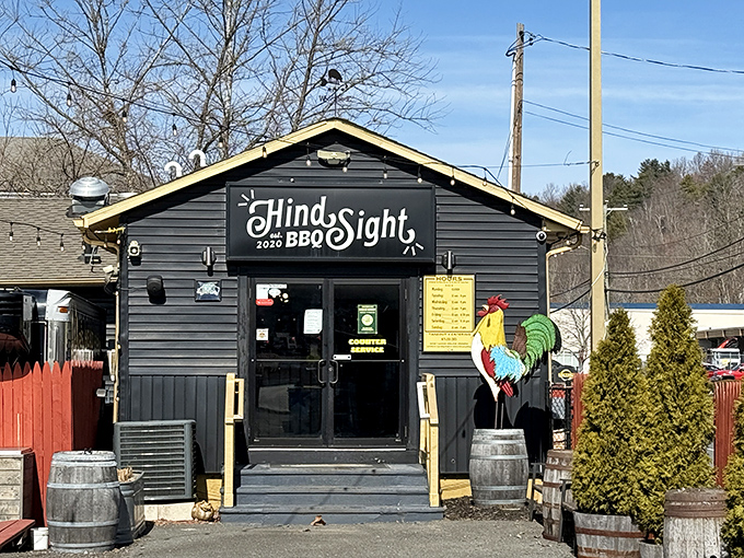 The unassuming black shack with its cheerful rooster sentinel promises smoky treasures within. BBQ paradise rarely comes with neon signs.