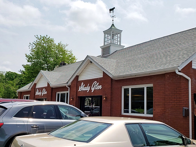 The iconic brick exterior of Shady Glen, with its distinctive cupola, stands as a beacon of comfort food in Manchester. Connecticut's culinary time machine awaits.