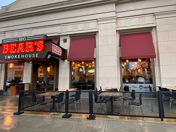 That iconic red neon Bear's sign beckons barbecue pilgrims like a smoky lighthouse guiding hungry souls to meaty salvation.