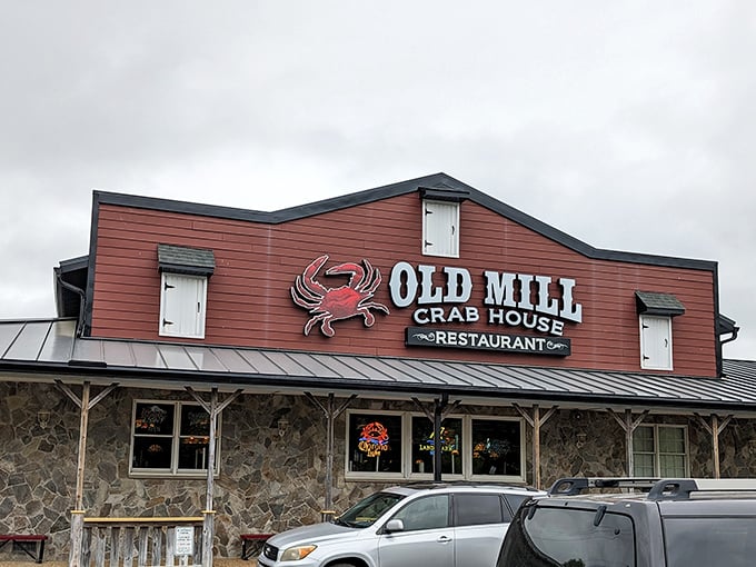 The iconic red exterior of Old Mill Crab House stands proudly against the Delaware sky, like a beacon calling all seafood lovers home.