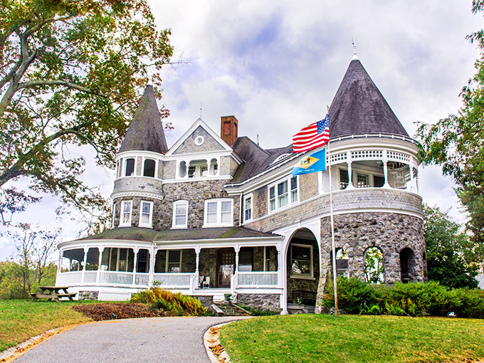 The majestic Auburn Heights mansion stands like a Victorian time capsule, with vintage automobiles parked out front as if waiting for their Gatsby-era owners to return.