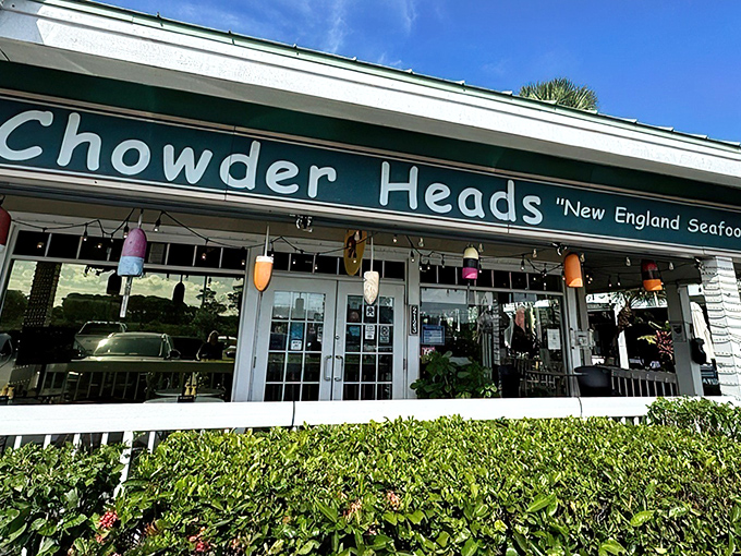 The green-roofed sanctuary of seafood salvation announces itself with colorful buoys and a promise of New England flavors that feels like a coastal hug.