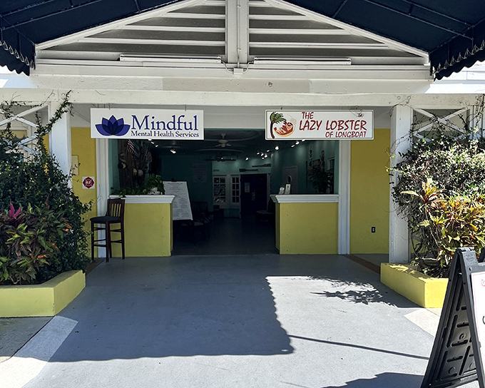 The sunshine-yellow exterior of Lazy Lobster stands out like a beacon of seafood hope on Longboat Key, promising delicious treasures within.