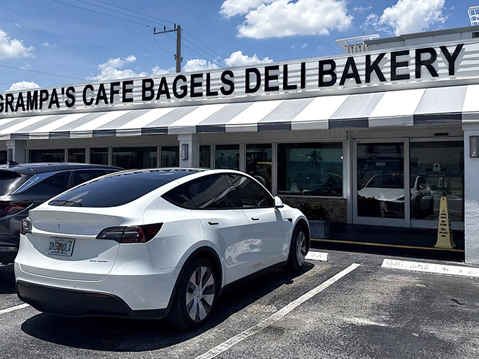 The classic striped awning of Grampa's isn't just eye-catching&mdash;it's a beacon for sandwich pilgrims seeking pastrami perfection in Dania Beach.