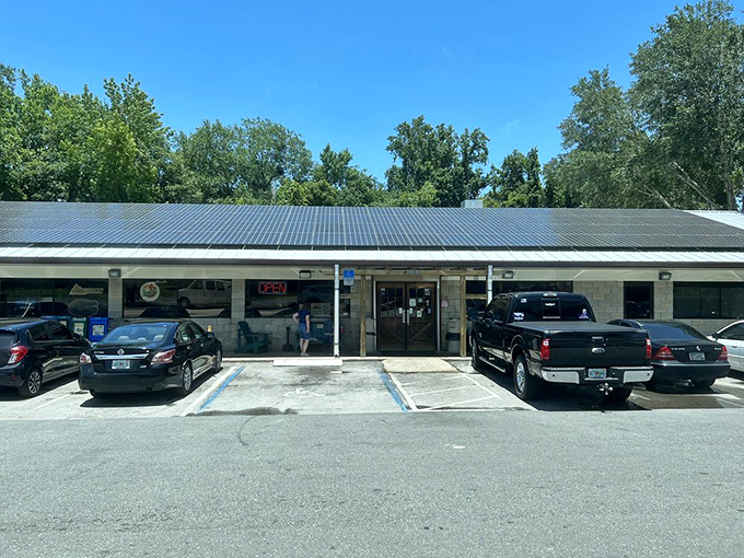 Another view of Pearl's modest storefront, where pickup trucks and sedans gather like pilgrims at a smoky, delicious shrine.