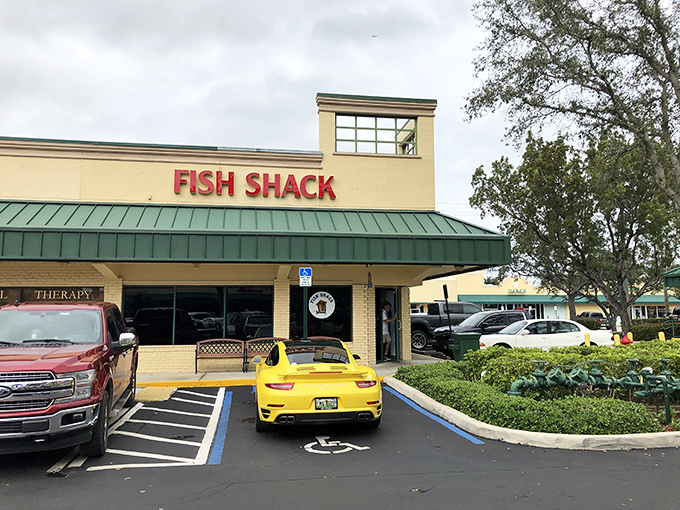 The unassuming yellow exterior of Fish Shack belies the culinary treasures within—proof that in Florida, the best seafood often hides in plain sight.