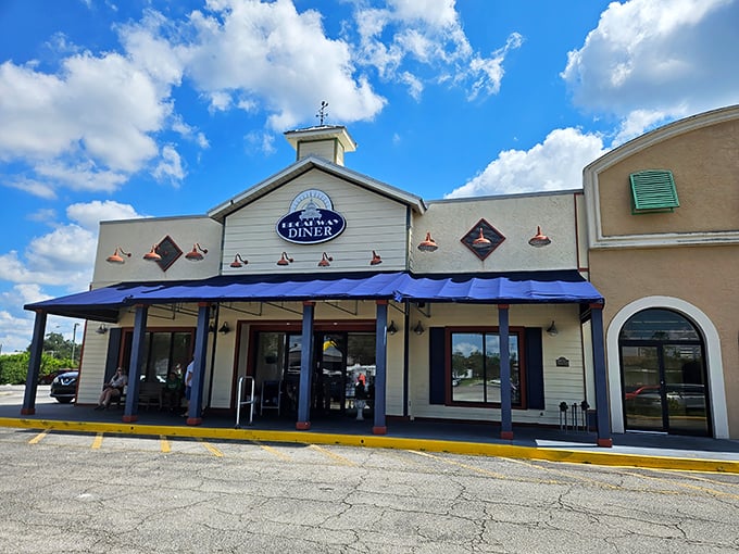 Not all heroes wear capes &ndash; some wear blue awnings. Broadway Diner's charming exterior promises comfort food salvation for hungry travelers crossing Polk County.