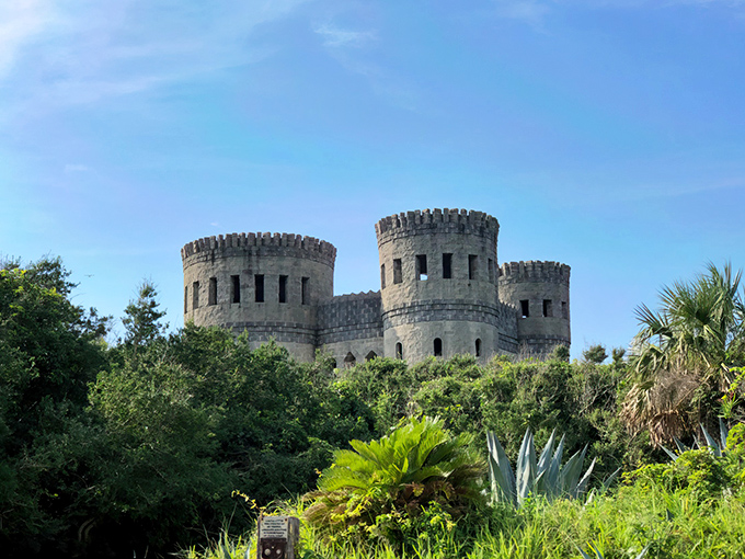 Medieval dreams rise from Florida's coastal landscape&mdash;Castle Otttis stands defiantly against the blue sky, its stone towers emerging from lush subtropical vegetation.