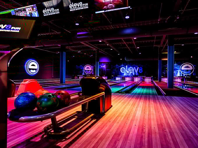Elev8 Fun's state-of-the-art bowling lanes glow with neon ambiance, transforming a classic game into a vibrant, immersive experience.