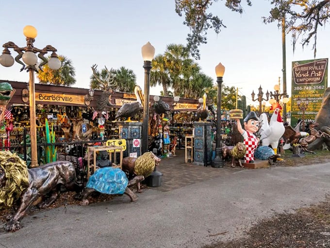 The Barberville Yard Art Emporium transforms a Florida crossroads into a fantastical open-air gallery where concrete creatures and colorful oddities create an unforgettable roadside experience.