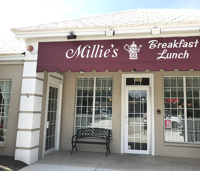 The unassuming storefront of Millie's beckons with its burgundy awning and simple bench&mdash;proof that culinary treasures often hide in plain sight.