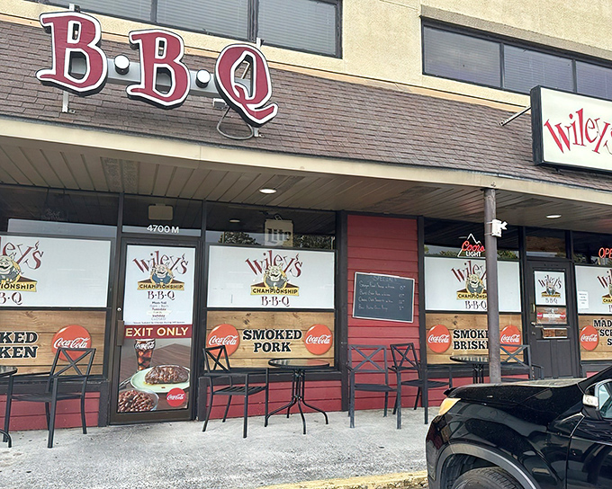 The red-trimmed storefront beckons like a barbecue beacon. That smiling pig logo knows exactly what deliciousness awaits inside.