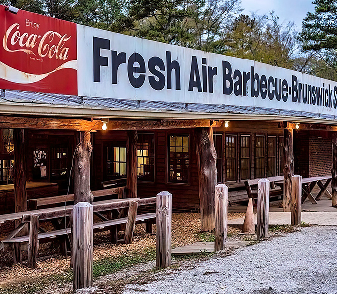 Twilight transforms Fresh Air Bar-B-Que into a beacon of smoky promise, its humble exterior hiding culinary treasures that locals have cherished for generations.