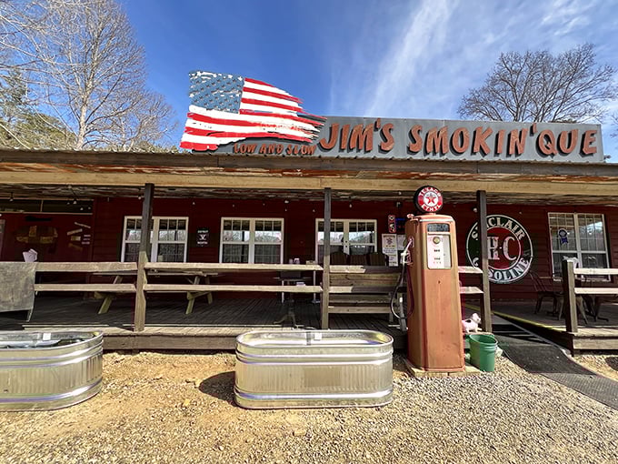 The American flag waves proudly above Jim's Smokin' Que, where that vintage gas pump isn't just decoration&mdash;it's a promise of old-school authenticity.