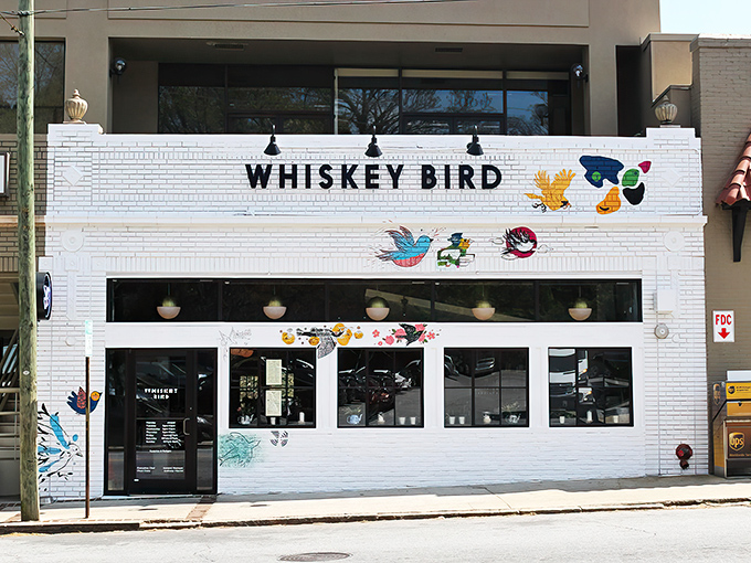 The colorful bird murals adorning Whiskey Bird's white brick fa&ccedil;ade aren't just decoration&mdash;they're a promise of the vibrant flavors waiting inside this Atlanta gem.