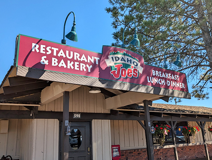The iconic red signage of Idaho Joe's beckons hungry travelers like a lighthouse for comfort food enthusiasts navigating the sea of chain restaurants.