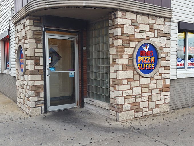 The stone facade entrance to Hienie's Pizza Slices beckons like a culinary lighthouse in a sea of Chicago storefronts. Simple, unpretentious, and promising delicious treasures within.