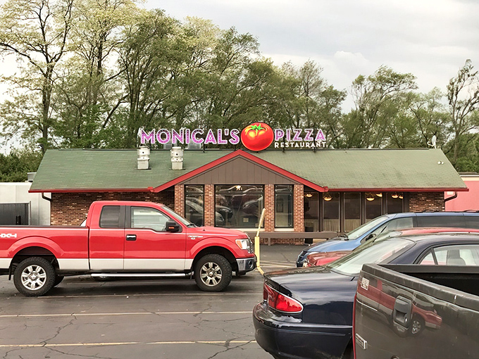 That giant tomato on the roof isn't just decoration&mdash;it's a beacon of hope for the pizza-starved souls of Pekin. No fancy architecture needed when the food speaks this loudly.