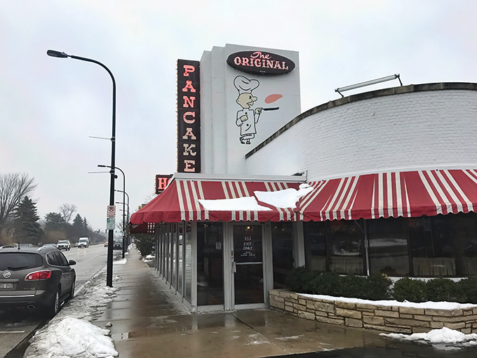 The iconic red and white awnings of Walker Bros. Original Pancake House in Wilmette stand as a beacon of breakfast hope, even on the grayest Illinois morning.