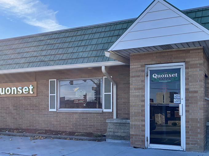 The distinctive green-roofed Quonset hut isn't trying to win architectural awards—it's too busy perfecting what's inside. A Waukegan landmark that promises comfort over pretension.