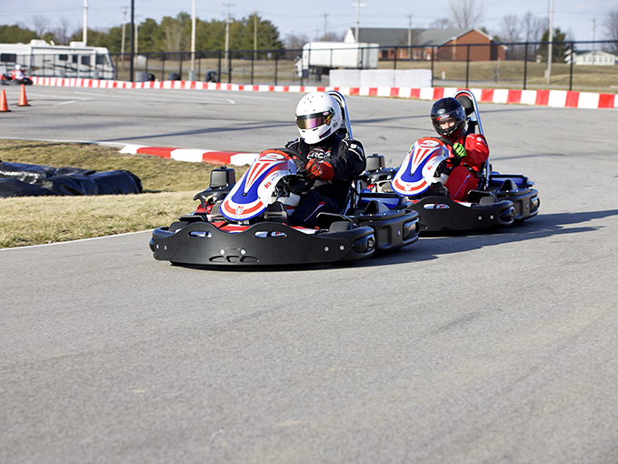 Speed demons take the curve at K1 Circuit, where everyday Hoosiers transform into racing legends under Indiana's big blue sky.