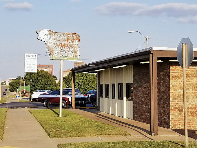 The iconic cow sign stands sentinel outside Murphy's, a beacon of hope for the hungry and a landmark that's been guiding Oklahomans to comfort food nirvana for generations.