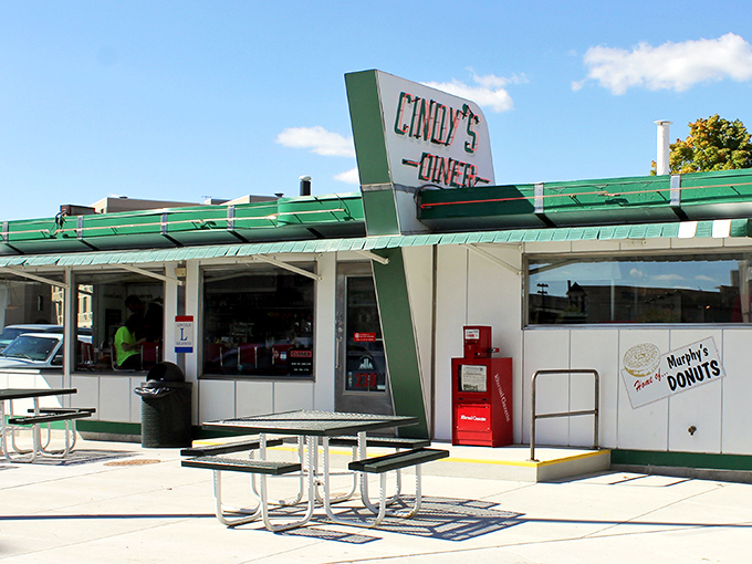 The mint-green exterior of Cindy's Diner stands like a time capsule in downtown Fort Wayne, promising nostalgic flavors and the comfort of simpler times.