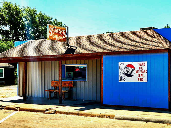 The unassuming exterior of Joe Snuffy's, with its bright blue wall and Eisenhower tribute, proves great food often hides in plain sight.