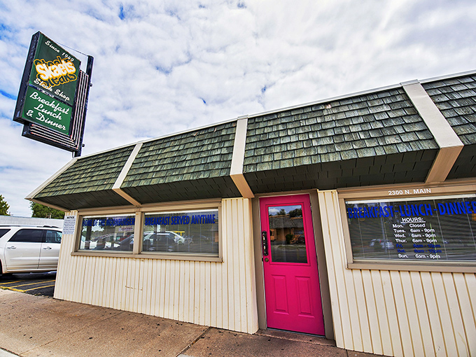 The modest exterior with its iconic red roof stands like a beacon in the night. No fancy frills, just the promise of honest-to-goodness Kansas cooking inside. 
