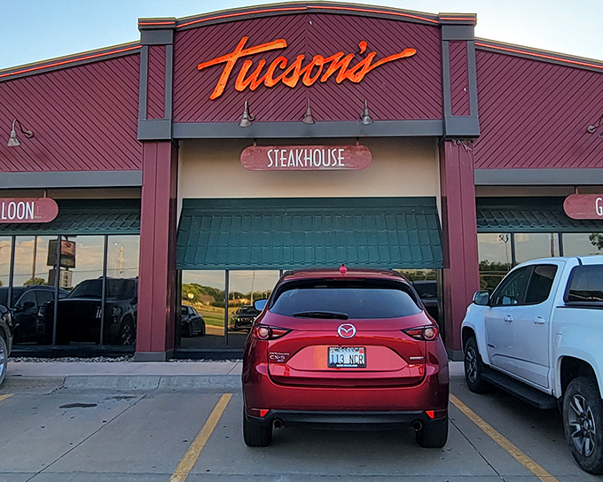 Tucson's distinctive red exterior beckons hungry travelers with its golden sign&mdash;a carnivore's paradise waiting just beyond those doors.