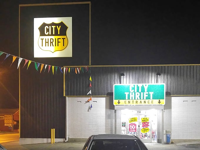 The iconic City Thrift sign glows like a beacon of bargain hope against the Kansas City night sky. Treasure hunters, your mothership awaits!
