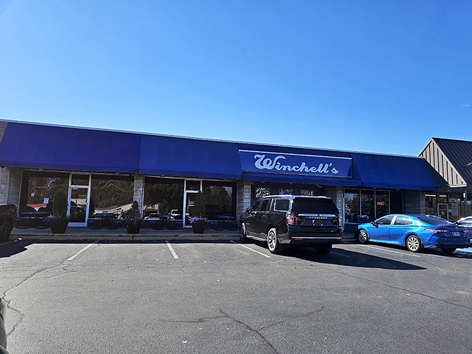 The iconic blue awning of Winchell's stands out like a beacon for hungry Lexington locals. This unassuming strip mall exterior hides culinary treasures that keep parking spots filled day after day.