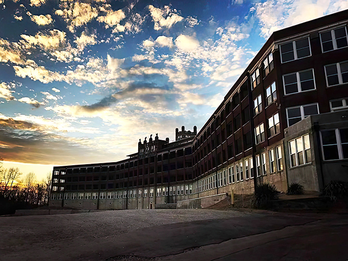 The imposing silhouette of Waverly Hills against a dramatic Kentucky sunset. Even beautiful light can't soften this building's haunting presence.