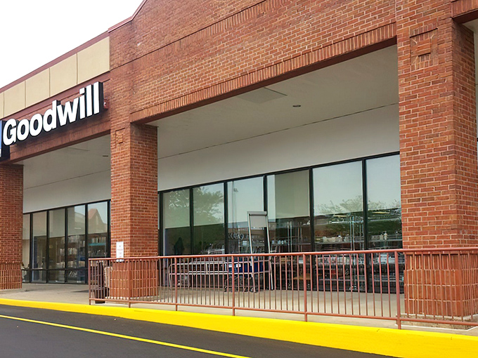 The brick facade of Winchester's Goodwill beckons like a siren song to bargain hunters. Behind these doors, treasures await the patient explorer.