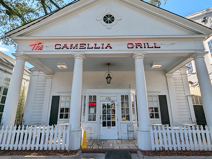 The stately white columns of The Camellia Grill welcome you like an old friend who happens to live in a Greek Revival mansion that serves incredible waffles.