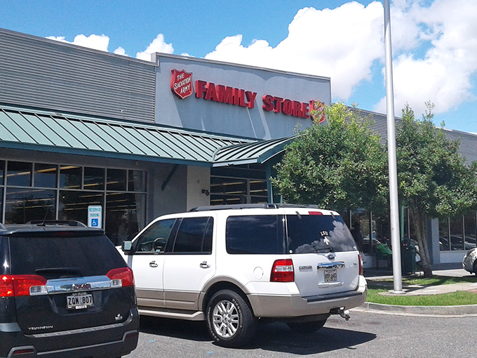 The Salvation Army Family Store stands ready for treasure hunters, its green awning like a welcome mat for bargain adventurers. A retail safari awaits inside!