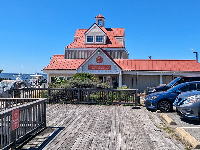 That iconic copper-red roof stands like a culinary lighthouse, beckoning hungry travelers across the Bay Bridge to seafood salvation.