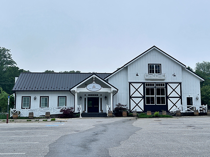 The Blackwall Barn & Lodge stands like a pristine white beacon against the Maryland sky, promising culinary adventures within its striking barn-inspired architecture.