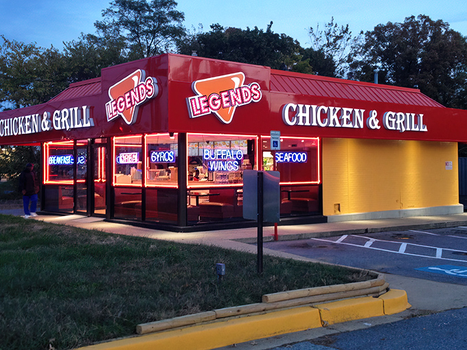 The iconic red awning of Legends glows like a beacon at dusk, promising comfort food that lives up to its name.