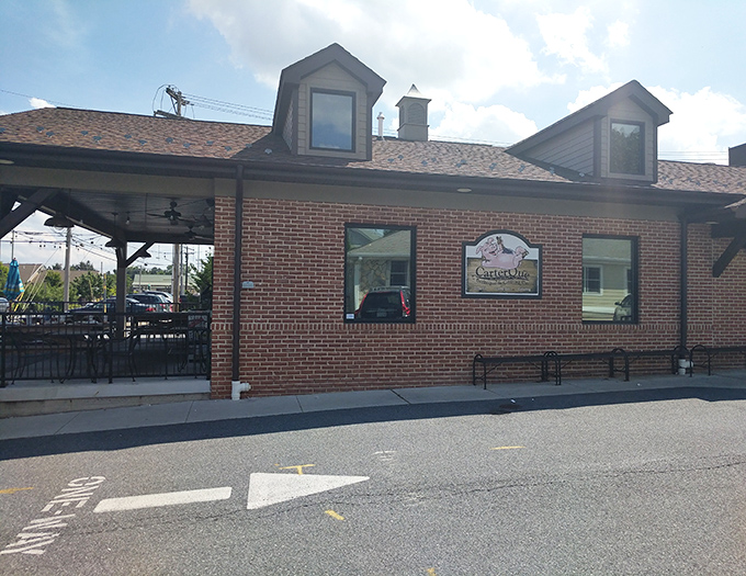 Brick exterior with a covered patio that whispers, "Stay awhile." In barbecue terms, this is what architects call "appetite-inducing design."