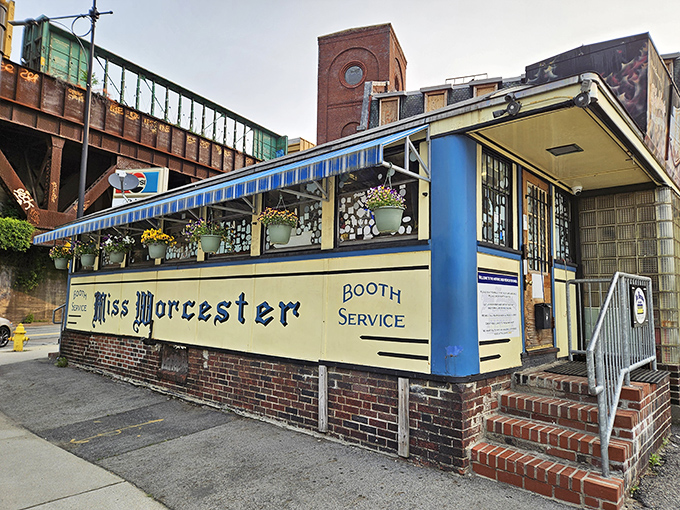 The iconic blue and cream exterior of Miss Worcester Diner stands like a time capsule beneath Worcester's industrial skyline, promising breakfast bliss just steps away.