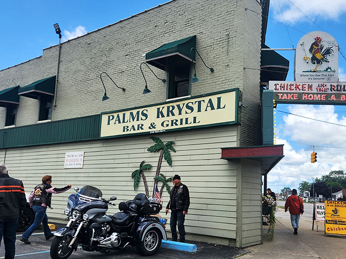 The mint-green exterior of Palms Krystal Bar & Grill stands as a beacon of comfort food in Port Huron, complete with that charming retro palm tree motif.