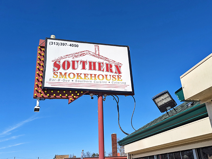 The iconic red and gold sign of Southern Smokehouse stands tall against Detroit's blue sky, a beacon calling hungry souls from miles around.
