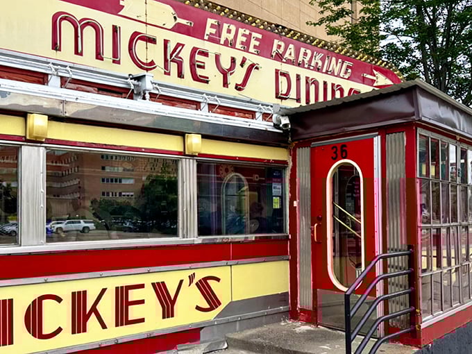 Mickey's iconic red and yellow exterior stands like a time capsule in downtown St. Paul, beckoning hungry travelers with its Art Deco charm.