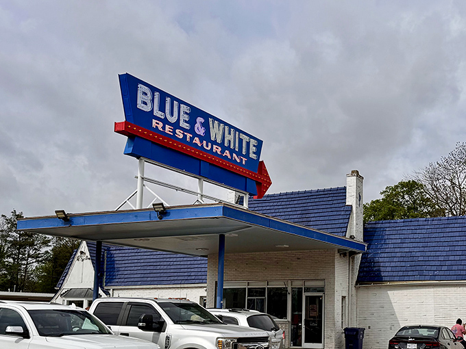 The iconic Blue & White sign stands proudly against the Mississippi sky, a beacon of comfort food that's been drawing hungry travelers for generations.