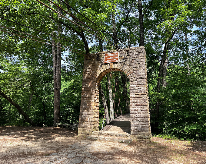 The iconic stone archway stands as a portal to adventure, inviting visitors to step back in time and into Mississippi's most geologically unique landscape.