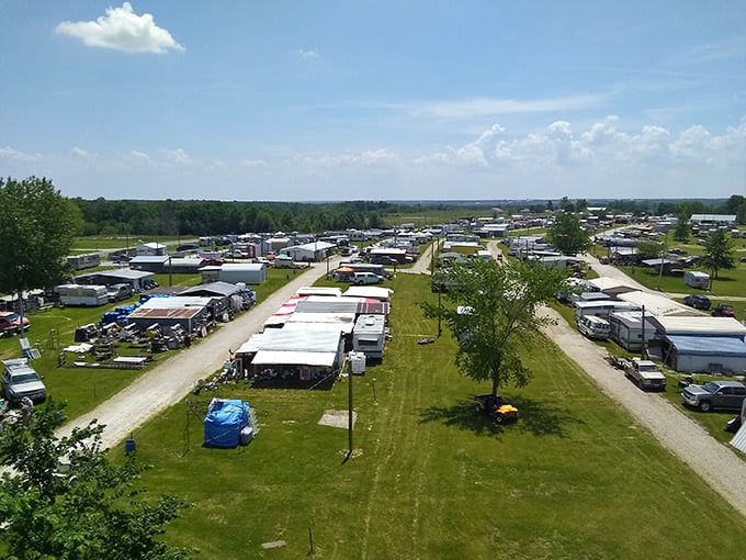 An aerial view reveals the true scale of Rutledge Flea Market, where rows of vendors create temporary neighborhoods of possibility under the vast Missouri sky.